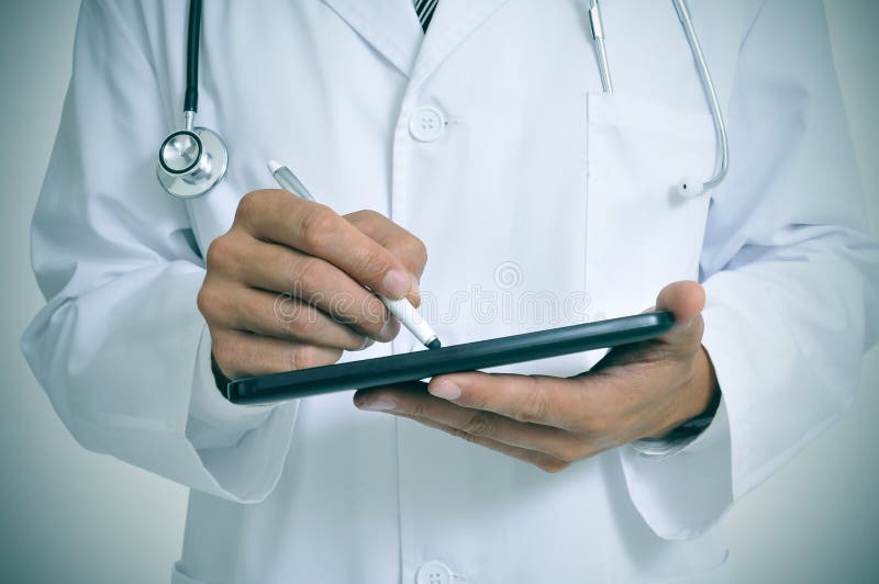 Doctor using a tablet stock photo. Image of checkup, person - 47635122