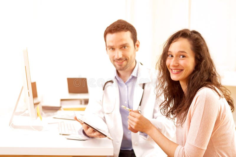 Doctor Using Tablet To Inform Patient Stock Photo - Image of office ...