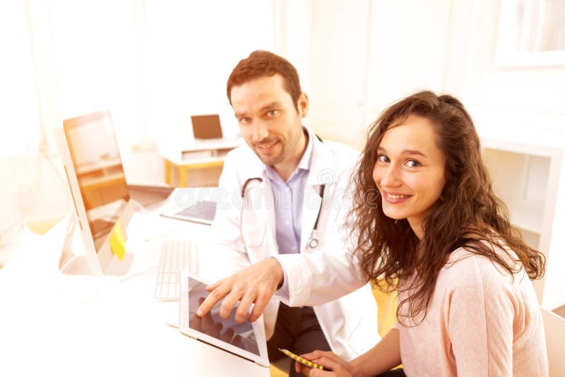 Doctor Using Tablet To Inform Patient Stock Image - Image of desk ...