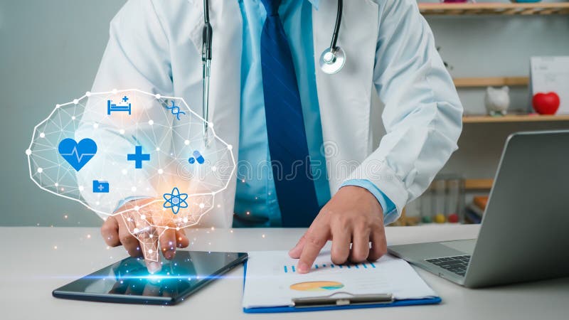 A Doctor Using Tablet To Review Treatment Plan and Write Document ... A Doctor Using Tablet To Review Treatment Plan and Write Document ...