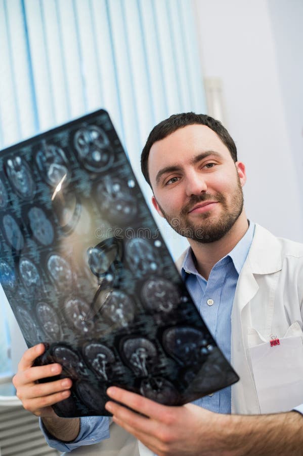 Doctor Viewing Mri X-ray of Brain in Office Stock Image - Image of ...