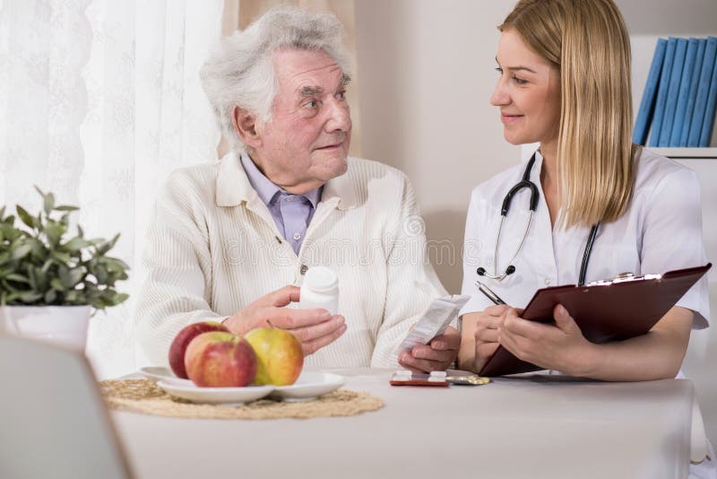 Doctor Visiting Patient at Home Stock Photo - Image of pretty ...