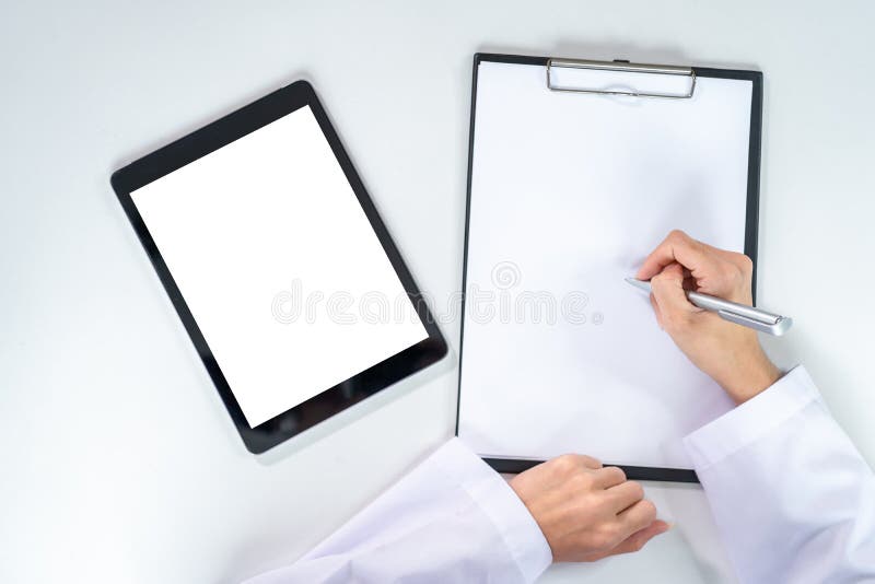 The Doctor Was Taking Notes in the Patient Data File Folder Stock Image ...