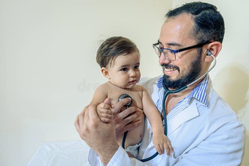 Doctor watching a baby stock image. Image of infant - 159942999