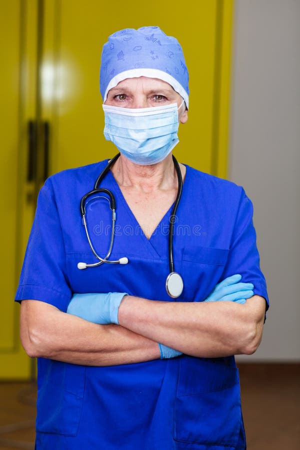 A Doctor Wearing Protective Accessories and a Blue Uniform Stock Photo ...