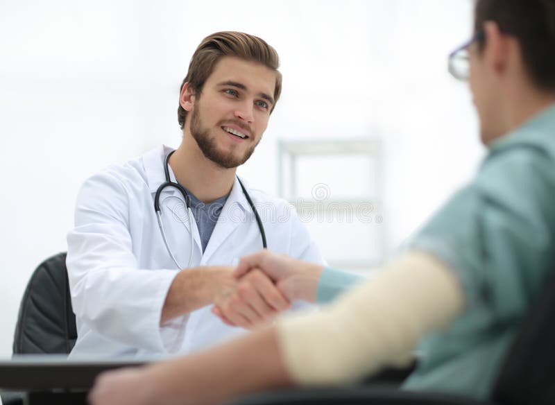 Doctor Welcoming a Patient in His Studio Stock Photo - Image of ...