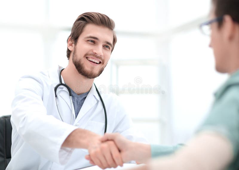 Doctor Welcoming a Patient in His Studio Stock Photo - Image of ...
