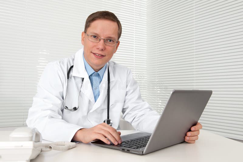 Doctor using computer stock image. Image of doctor, male - 3322507