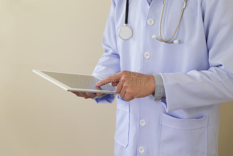 Doctor in White Lab Coat Using His Tablet Computer at Work Stock Photo ...