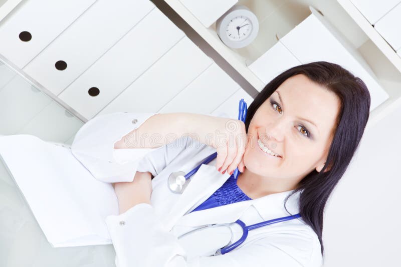 Doctor Woman Making Notes in Surgery Office Stock Image - Image of ...