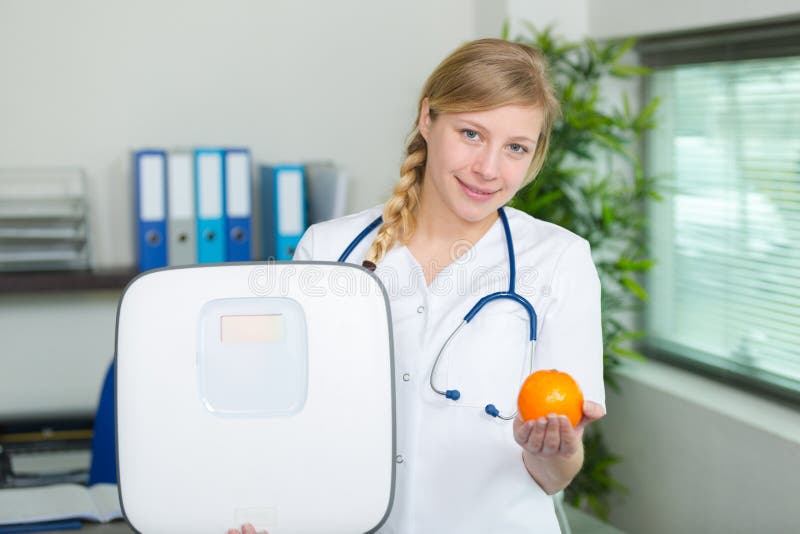 Doctor Woman with Scales and Apple Stock Image - Image of lady ...
