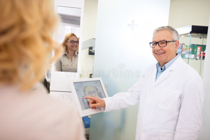 Doctor work on eye device stock photo. Image of ophthalmoscope - 67015448