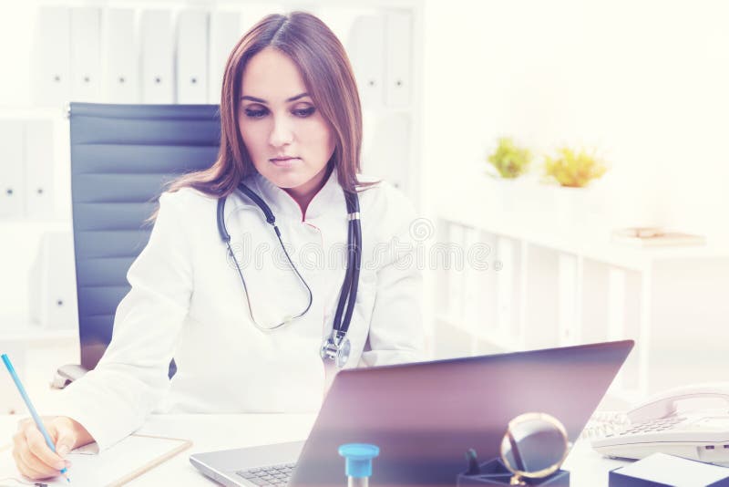 Doctor at work with laptop stock image. Image of ambition - 78625131