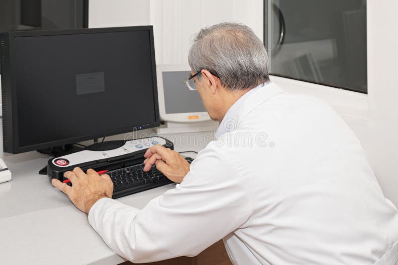 Doctor working at computer stock photo. Image of medicine - 26836492