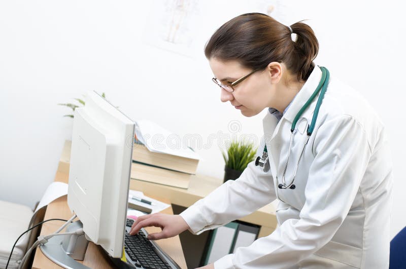 Doctor working on computer stock photo. Image of computer - 89838236