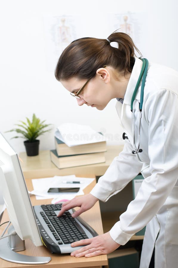 Doctor working on computer stock image. Image of chair - 90421187