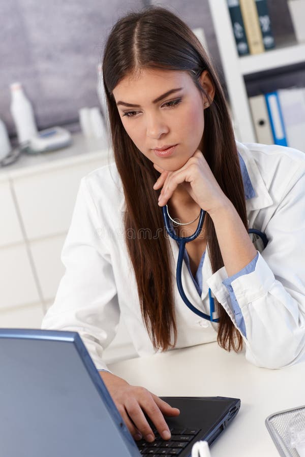 Doctor working on computer stock photo. Image of clinic - 31219348