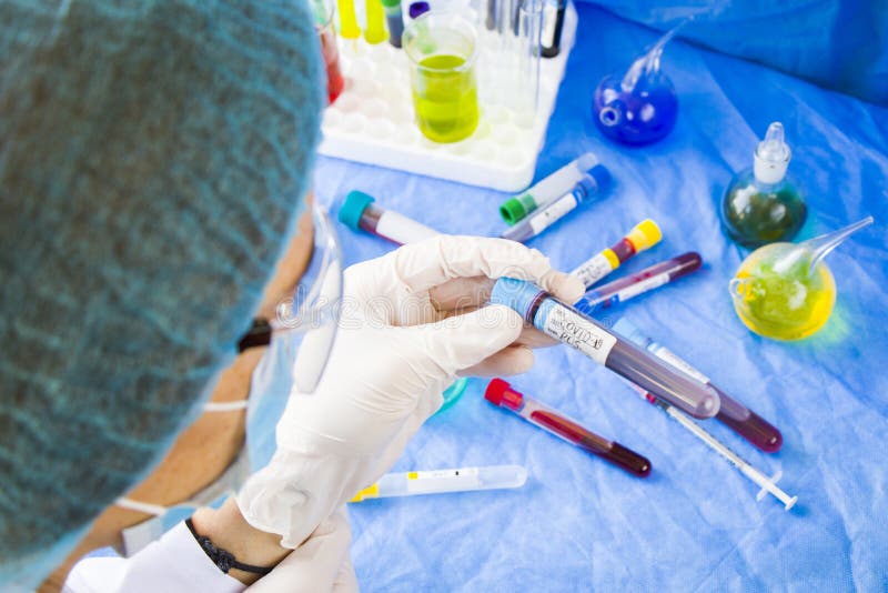 Doctor Working with Coronavirus Positive Test Samples in a Laboratory ...
