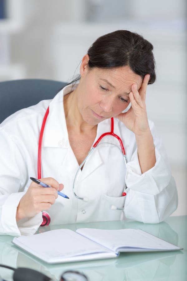 Doctor working at desk stock photo. Image of healthcare - 264392106