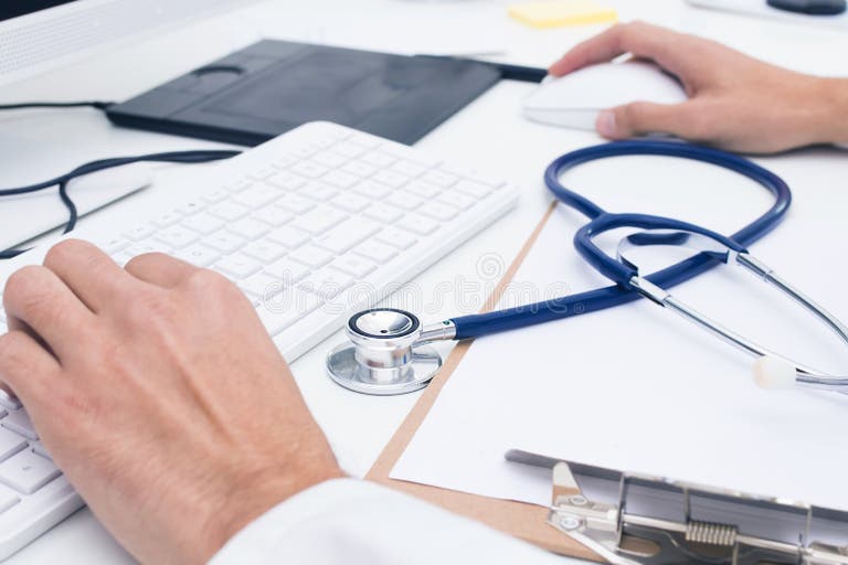 Doctor working at the desk stock image. Image of nursing - 116001679