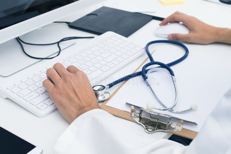 Doctor working at the desk stock photo. Image of wellness - 116001690