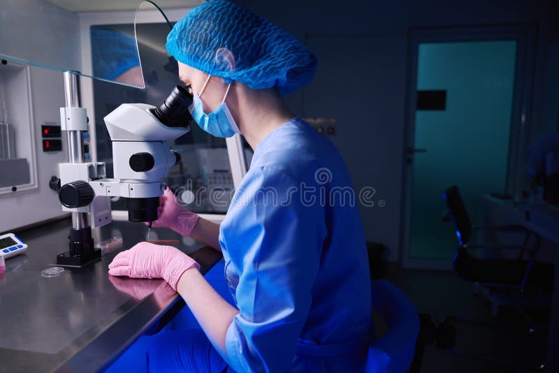Doctor Working in a Dimly Lit Lab Setting Stock Photo - Image of ...