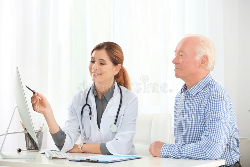 Doctor Working with Elderly Patient Stock Photo - Image of consult ...