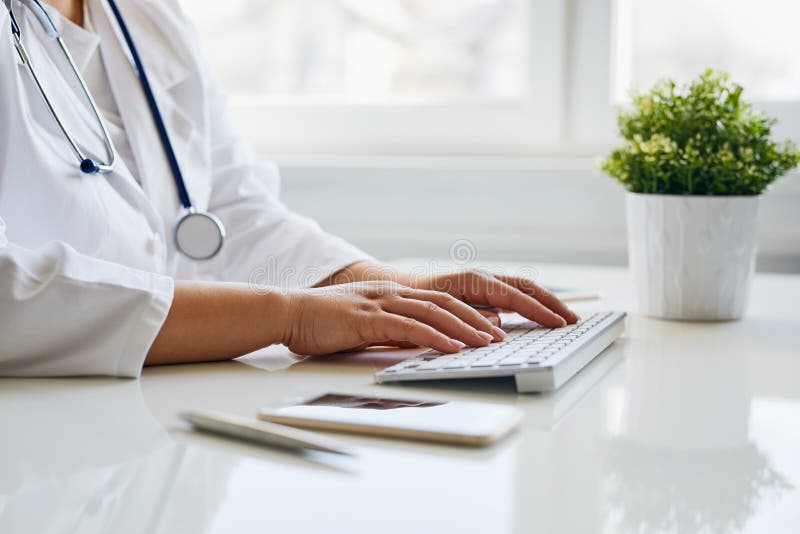 Doctor Working with Her Computer in Medical Office Stock Photo - Image ...