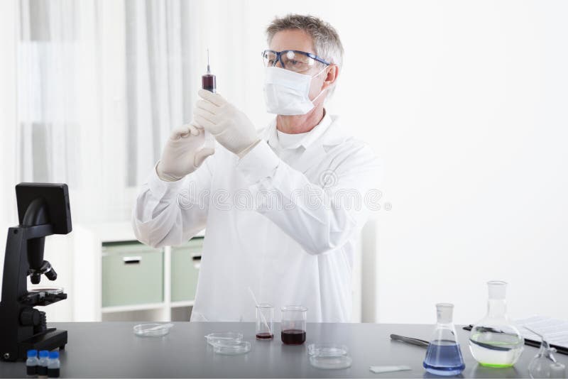 Doctor Working with Injection and Blood Stock Photo - Image of clinic ...