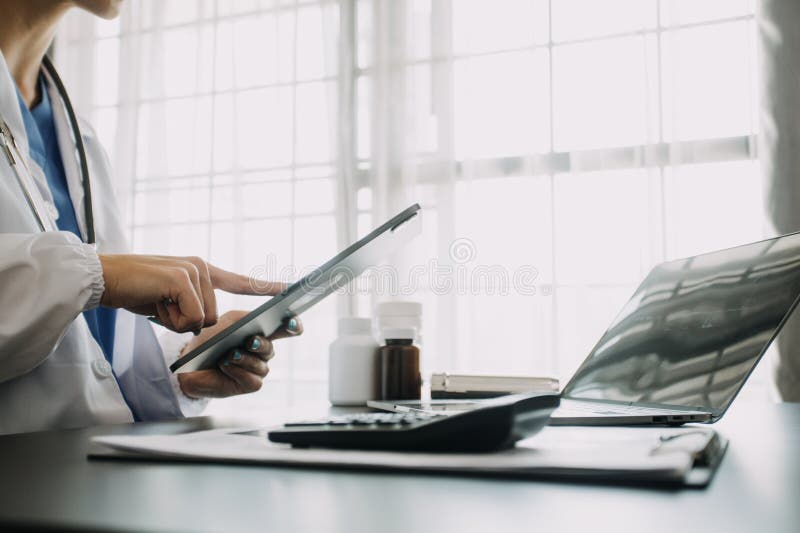 Doctor Working with Laptop Computer in Medical Workspace Office. Doctor ...
