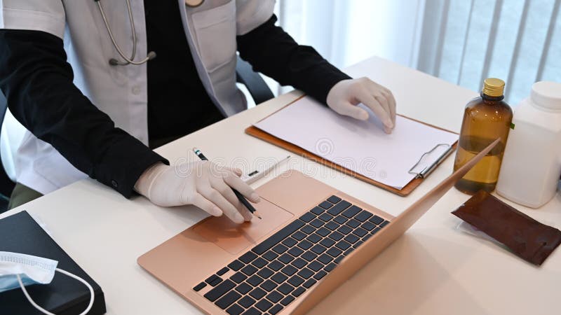 Doctor Working with Laptop Computer in Medical Office. Stock Image ...