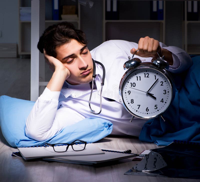 Doctor Working Night Shift in Hospital after Long Hours Stock Photo ...