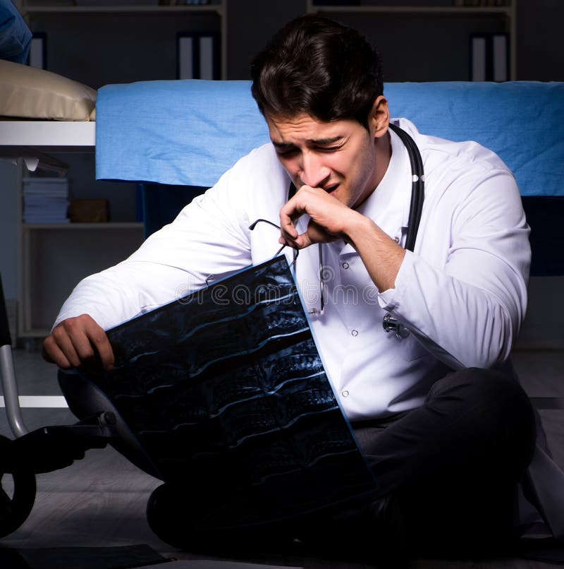 Doctor Working Night Shift in Hospital after Long Hours Stock Photo ...