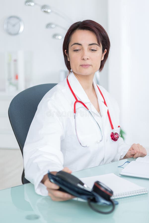 Doctor working in office stock photo. Image of clinic - 258799500