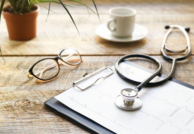 Doctor Workplace with a Stethoscope at Wooden Table Stock Photo - Image ...