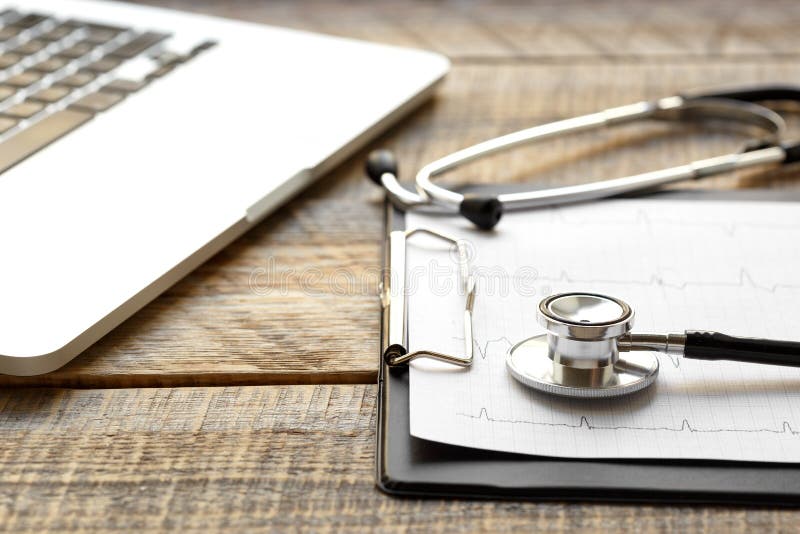 Doctor Workplace with a Stethoscope at Wooden Table Stock Photo - Image ...