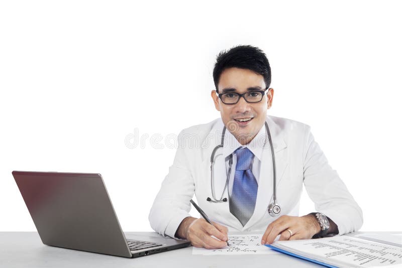 Doctor Writes a Prescription and Looking at Camera Stock Photo - Image ...