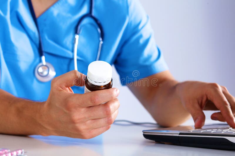 The Doctor Writes a Prescription Pill on the Computer Stock Image ...