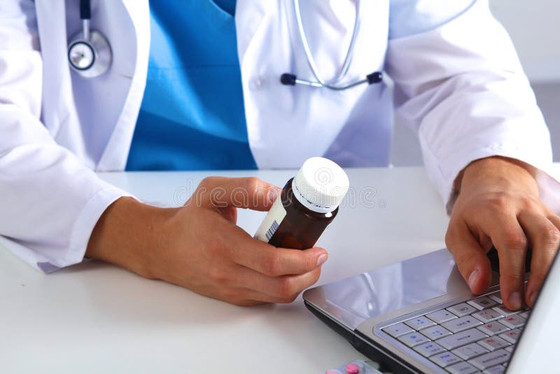 The Doctor Writes a Prescription Pill on the Computer Stock Image ...