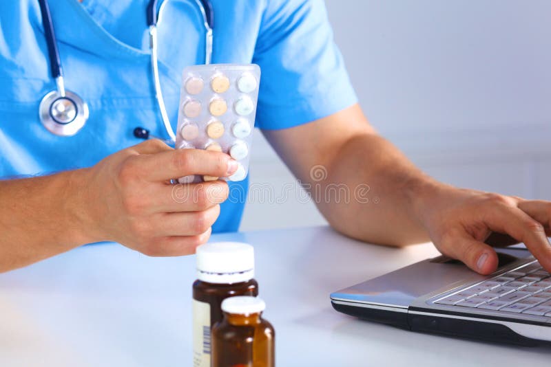 The Doctor Writes a Prescription Pill on the Computer Stock Image ...
