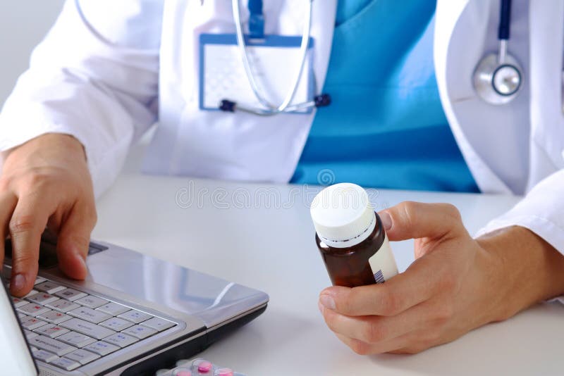The Doctor Writes a Prescription Pill on the Computer Stock Image ...