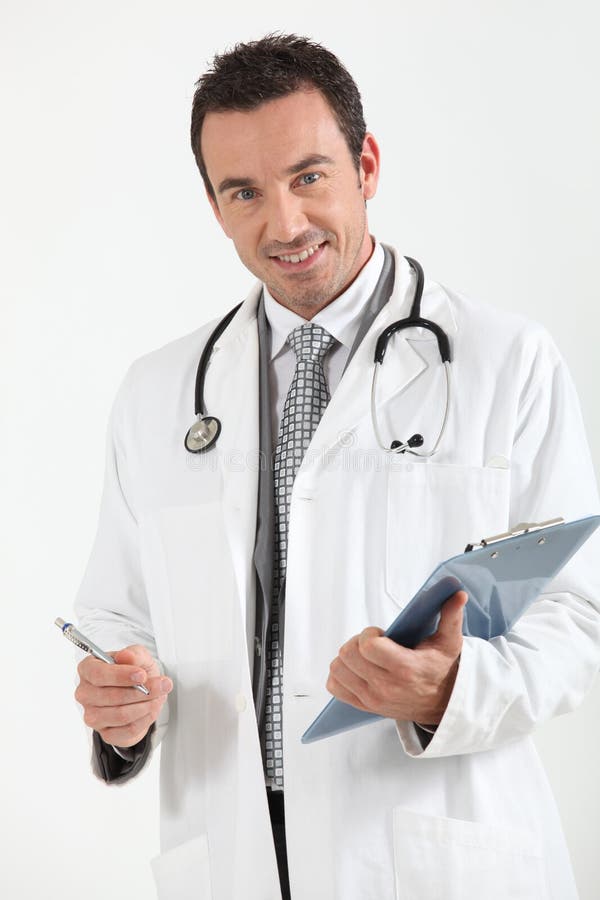 Doctor Writing on Clipboard Stock Photo - Image of hair, smiling: 31380194