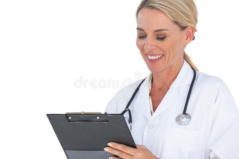Doctor Writing on a Clipboard and Smiling Stock Image - Image of ...