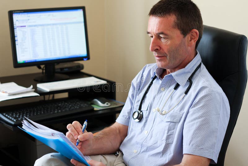 Doctor Writing on a Document Stock Photo - Image of practitioner ...