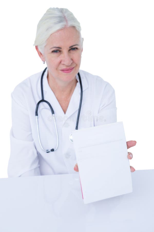 Doctor With Notepad And Colleagues Behind Her Stock Image - Image of ...