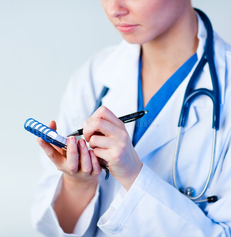 Doctor Writing a Perscription Stock Photo - Image of friendly, female ...