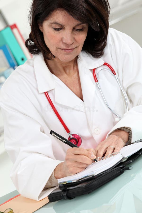 Doctor Writing a Prescription Stock Image - Image of examination, care ...