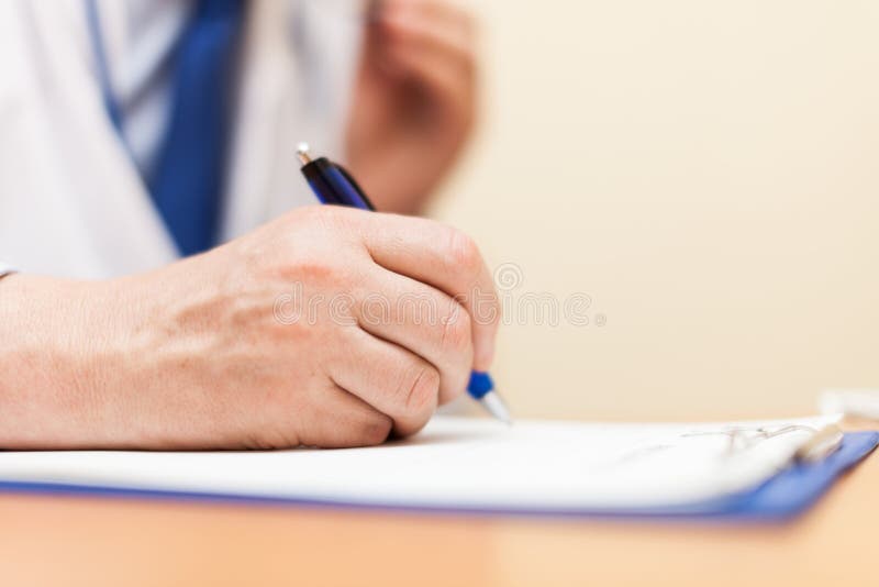 Doctor Writing a Prescription in His Studio Stock Photo - Image of ...