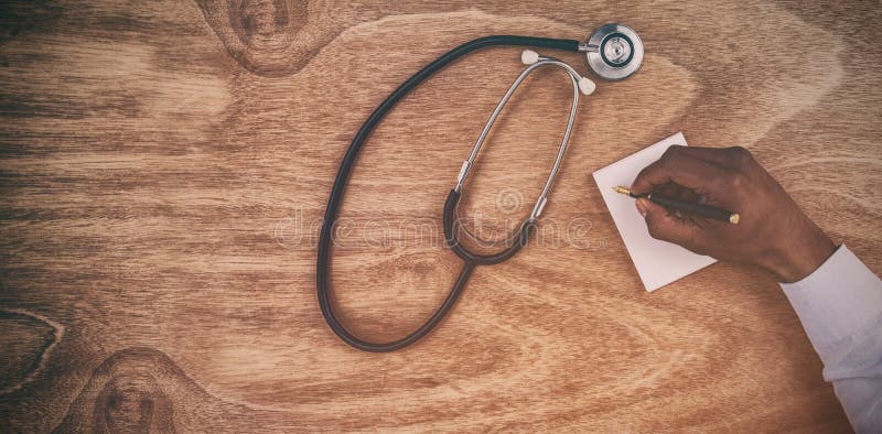 Doctor Writing Prescription on Notepad at Desk Stock Photo - Image of ...
