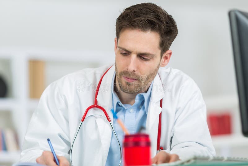 Doctor Writing Prescription in Office Stock Photo - Image of reading ...